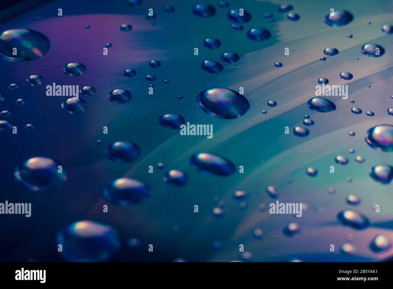 Close up beautiful abstract multi colored water drop of holographic ...