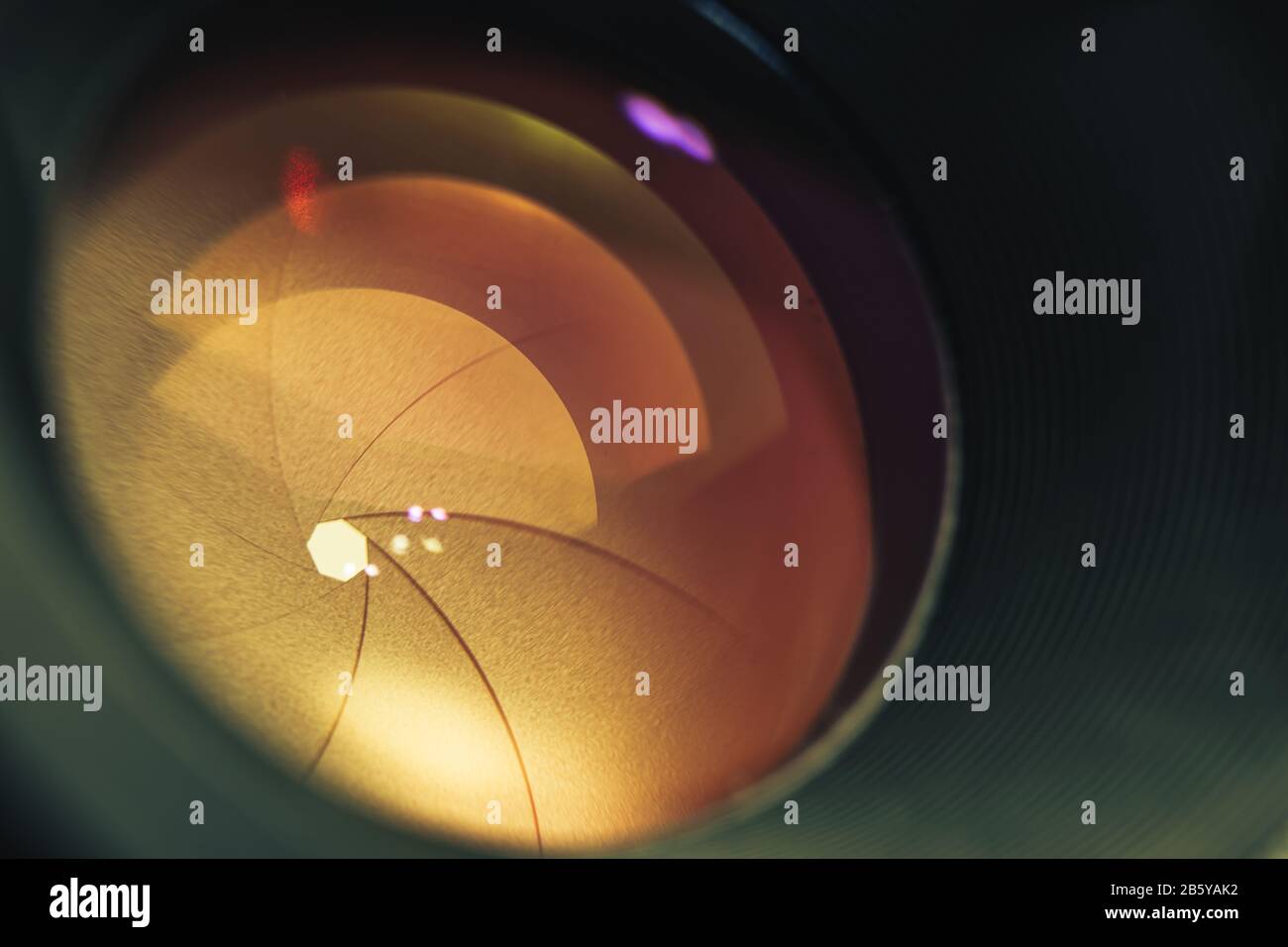 Beautiful camera lens with orange light of glass. Background pattern ...