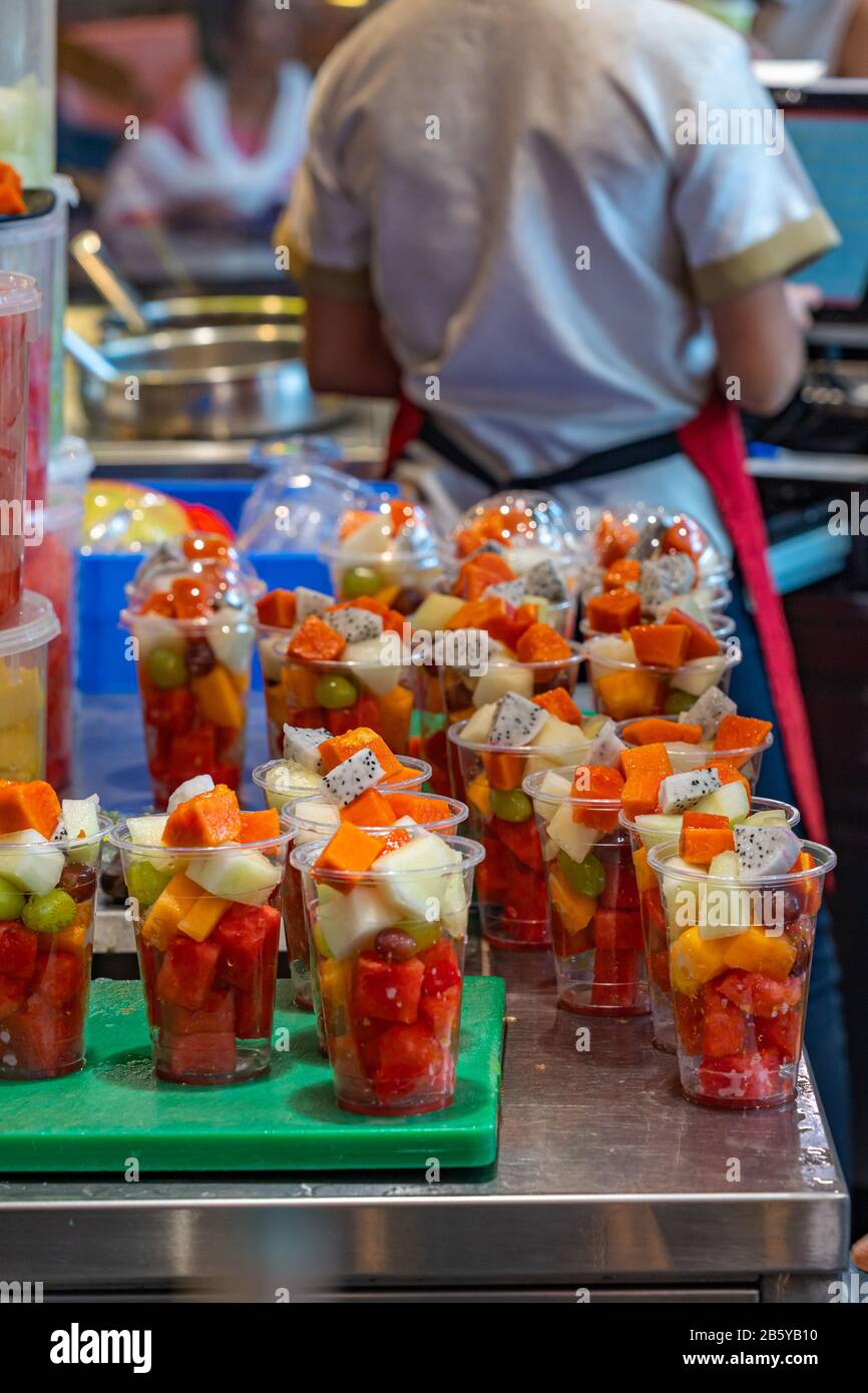 Colorful mixed fruit cups in dessert store's kitchen Stock Photo - Alamy