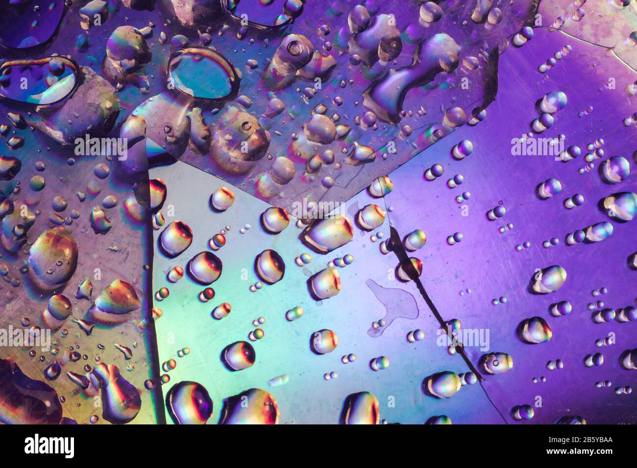 Beautiful abstraction violet blue color light water drop of holographic ...