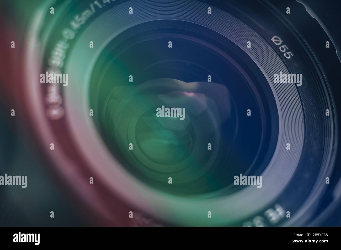 Beautiful camera lens with multi colored light of glass. Background ...