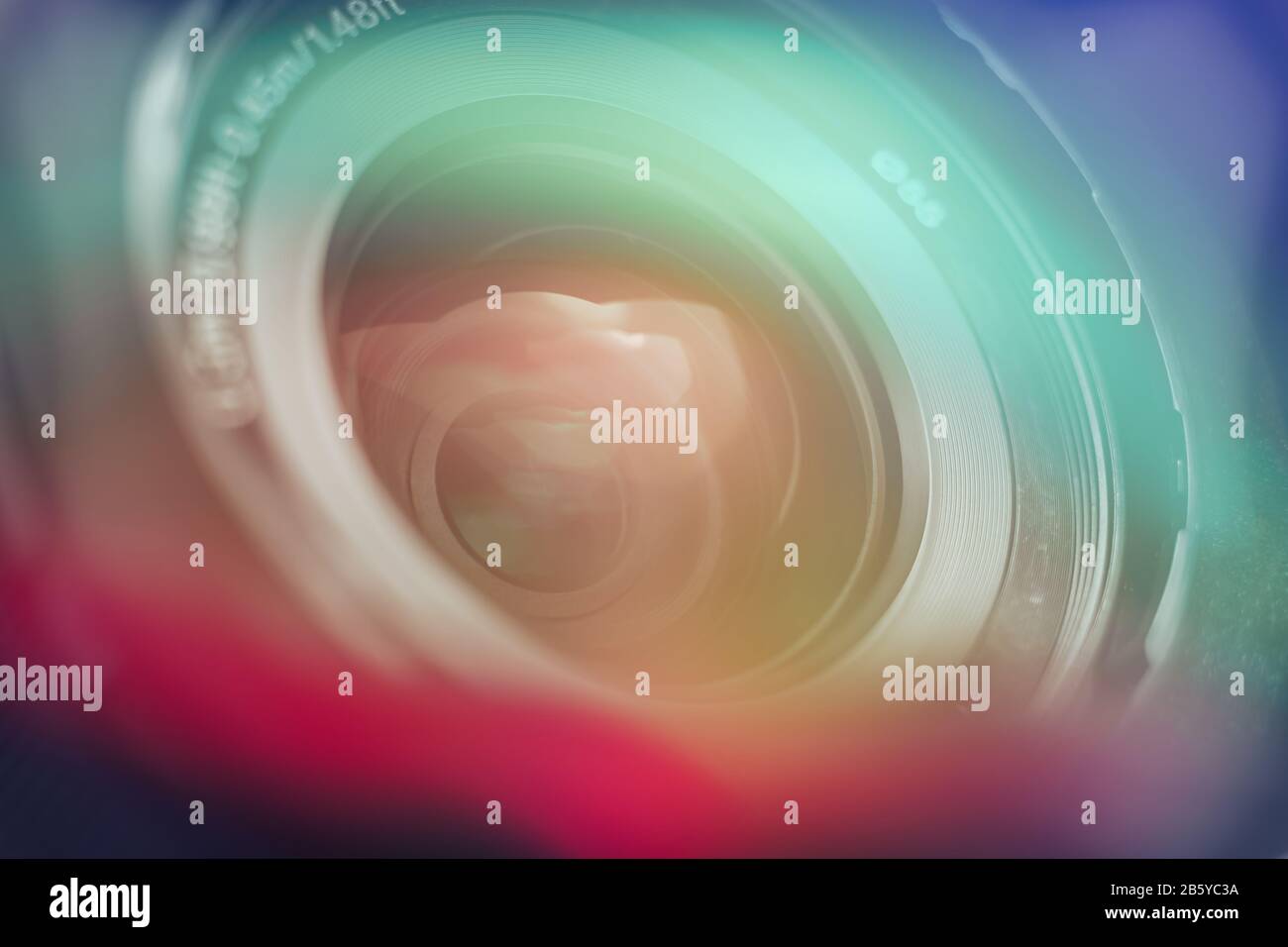 Beautiful camera lens with multi colored light of glass. Background ...
