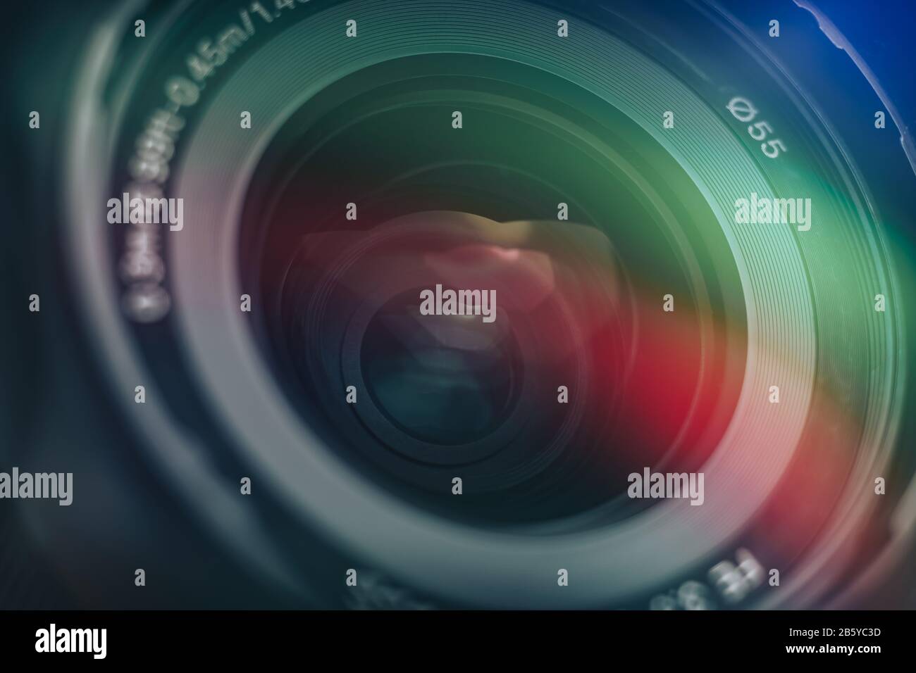 Close up Beautiful camera lens with multi colored light. Background ...