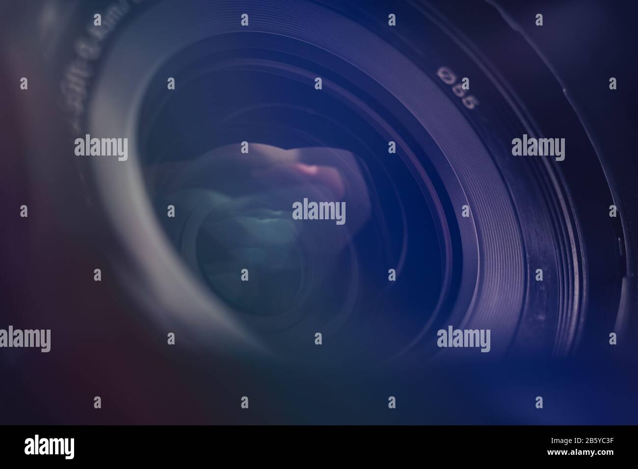 Beautiful camera lens with multi colored light of glass. Background ...