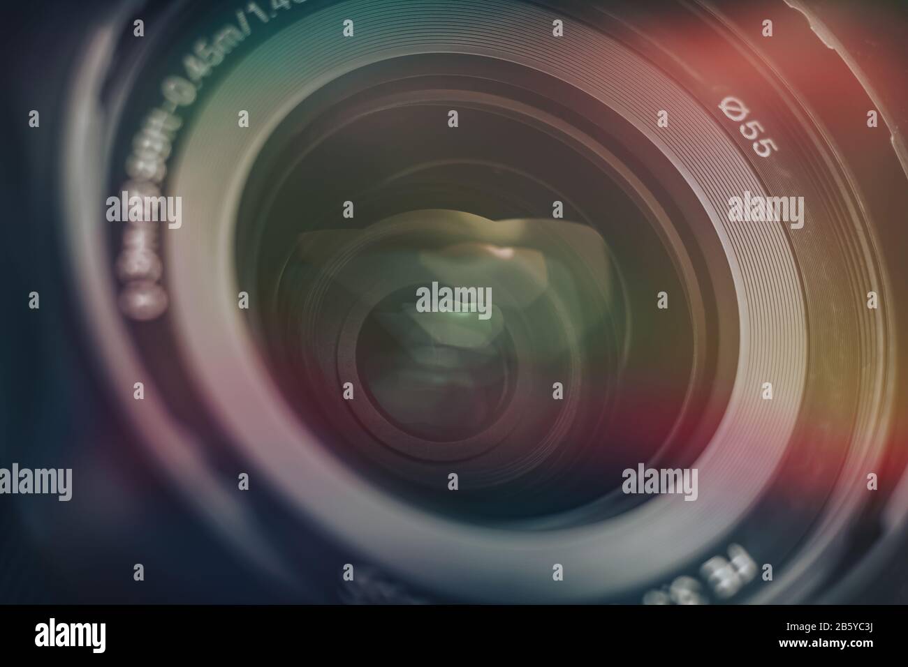 Beautiful camera lens with multi colored light of glass. Background ...