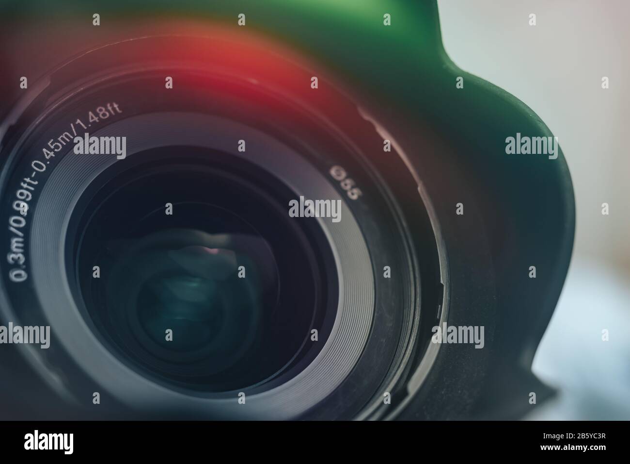 Beautiful camera lens with multi colored light of glass. Background ...