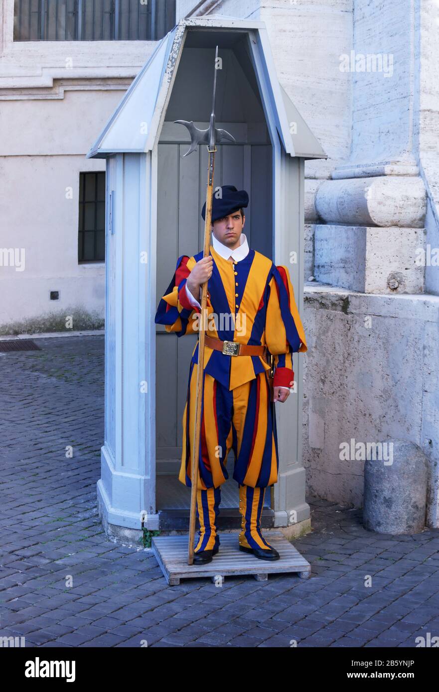 Italy.Rome.A Vatican guard on sentry duty outside St.Peter's Basilica ...