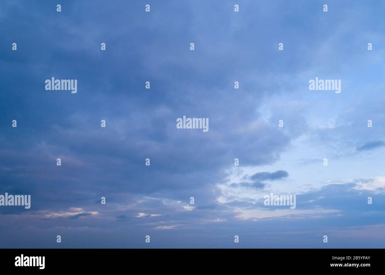 Beautiful sky with stretched clouds during twilight Stock Photo - Alamy
