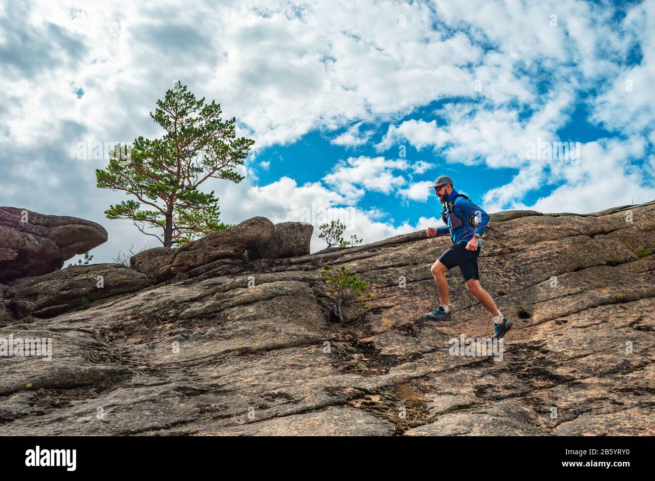 Adult running on rocks hi-res stock photography and images - Alamy