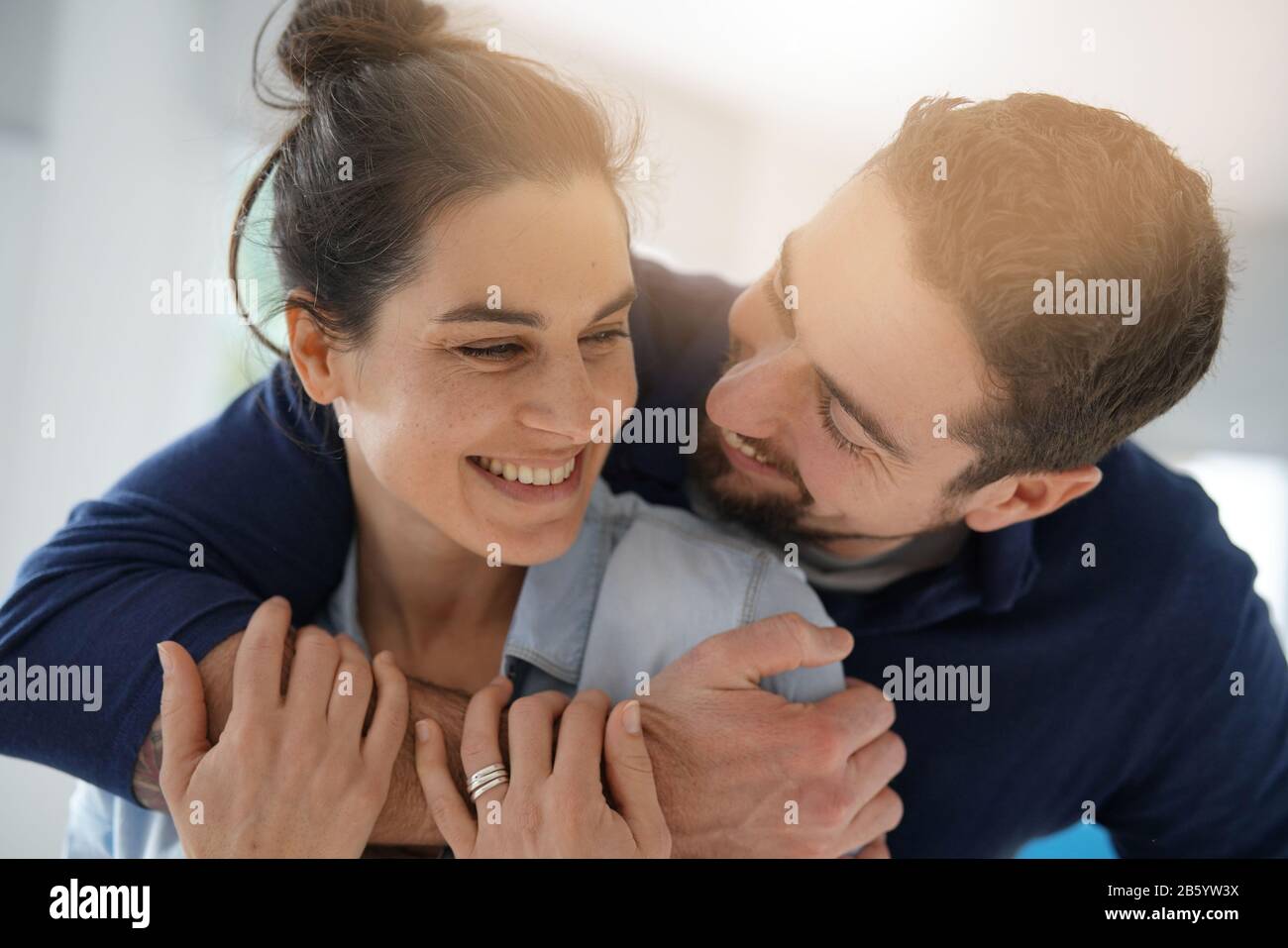 Cheerful romantic couple of lovers cuddling Stock Photo - Alamy