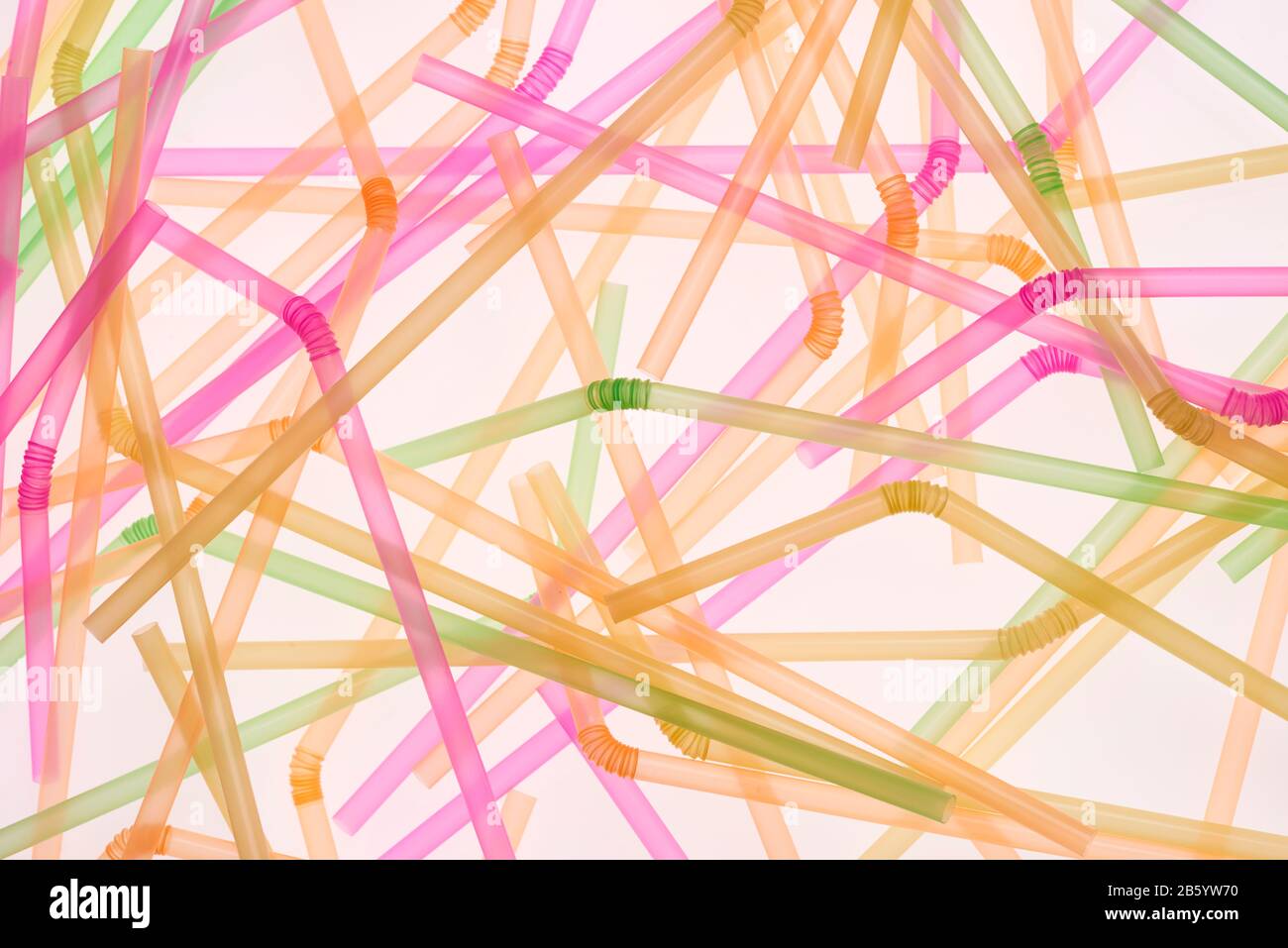 Colored drinking straws on white background Stock Photo - Alamy