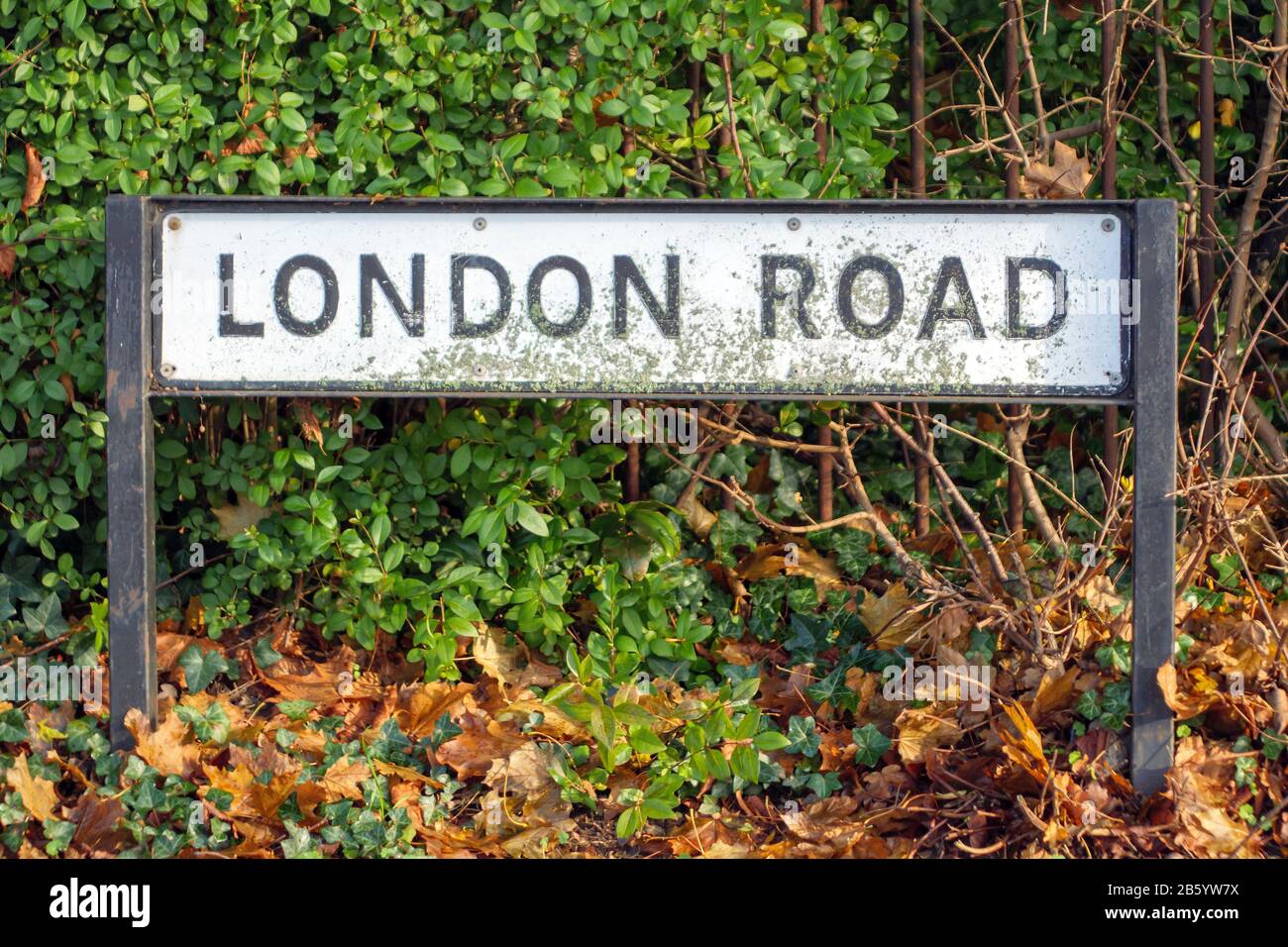 london road sign post in town in england uk Stock Photo - Alamy