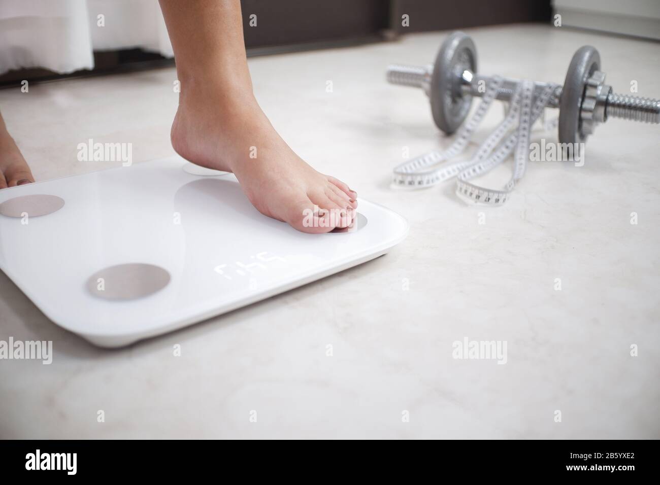 Female feet on a scale hi-res stock photography and images - Alamy