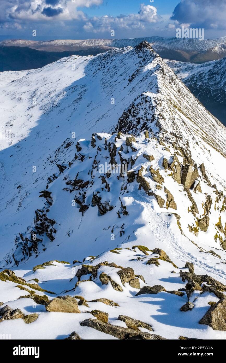 Striding Edge on Helvellyn in winter. The ridge is a popular summer ...