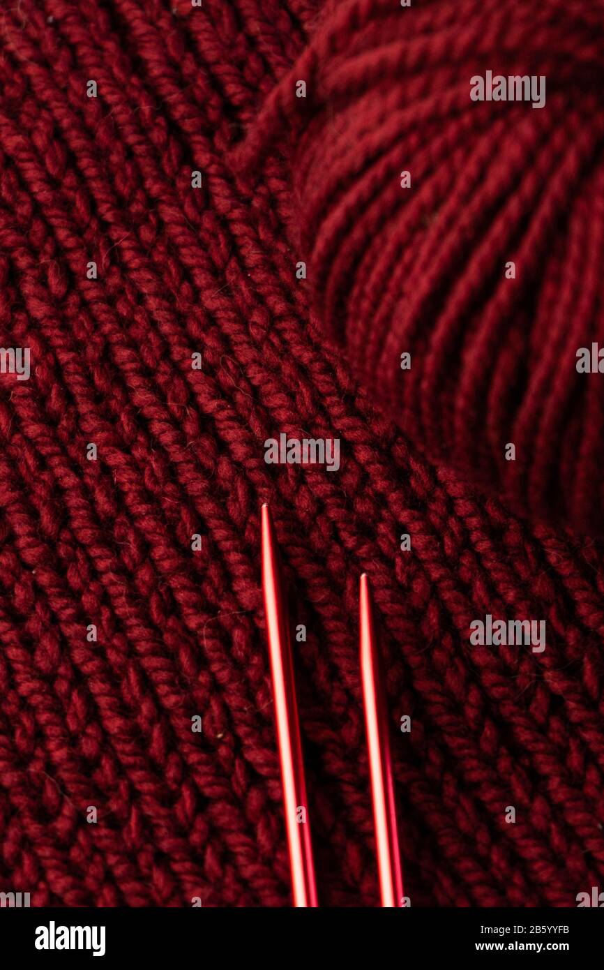 knitted fabric and needles with thick threads Stock Photo - Alamy