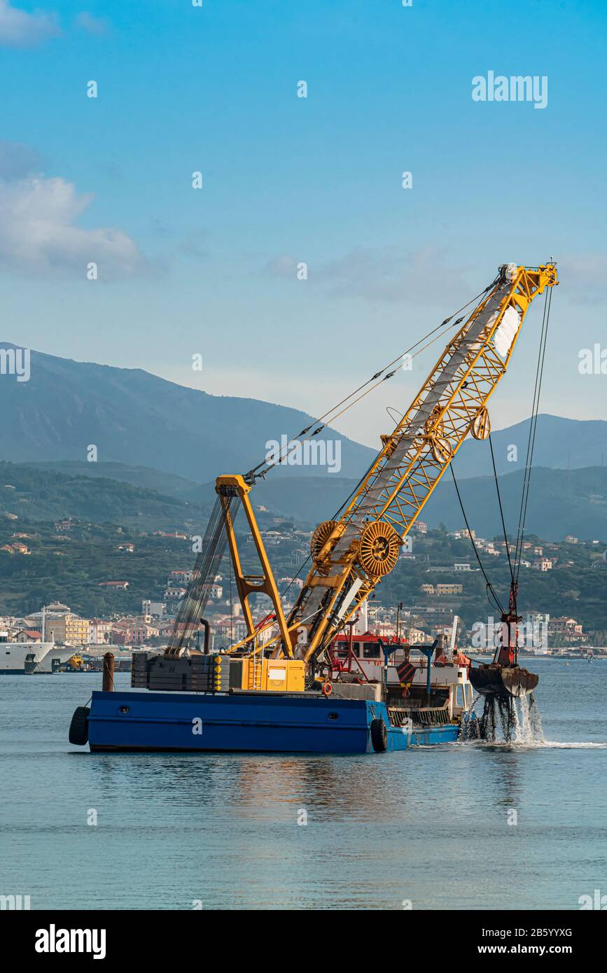 Hopper dredger working in old port of Savona, Italy Stock Photo - Alamy