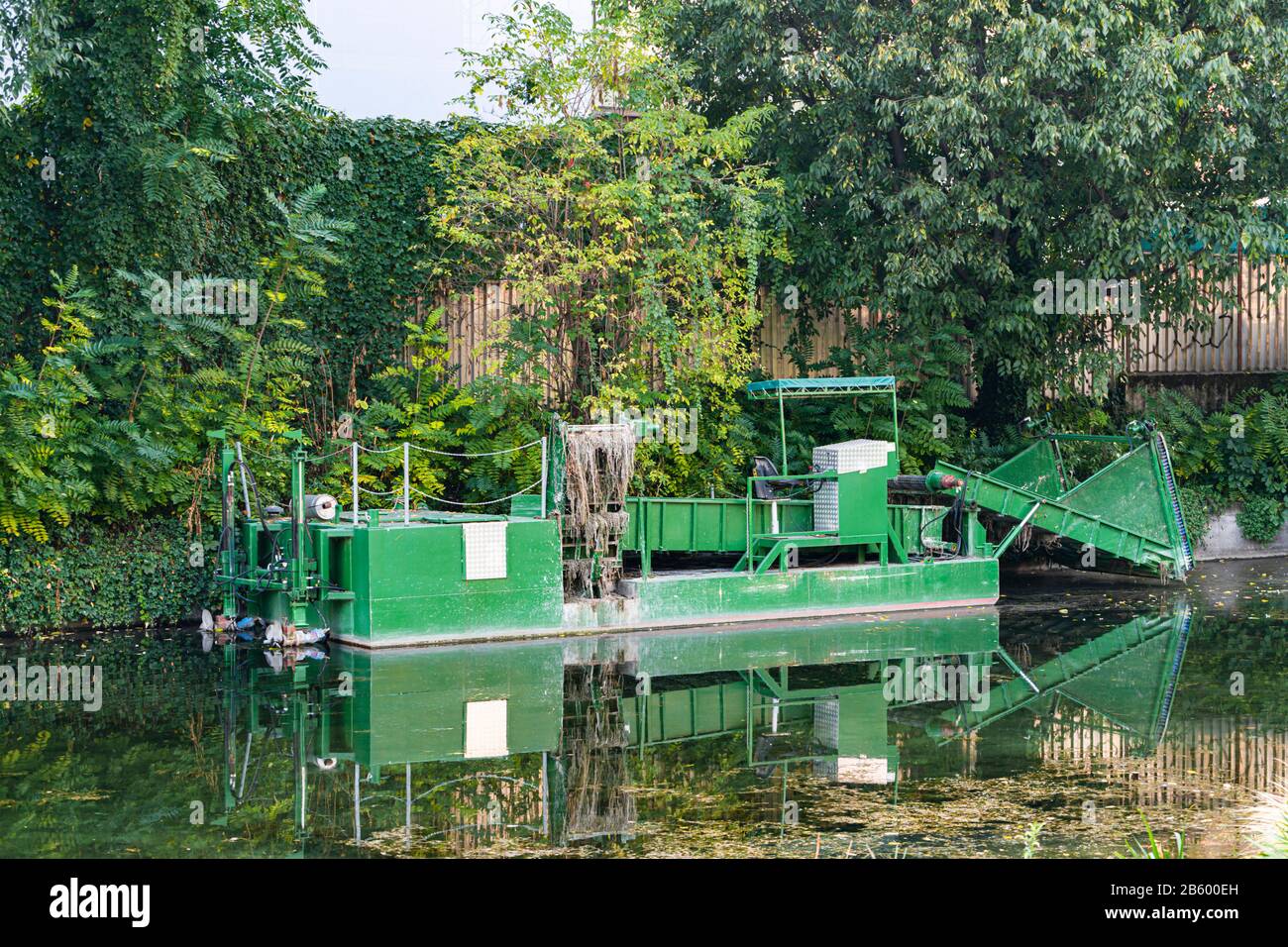 An aquatic weed harvester on a lake Stock Photo - Alamy