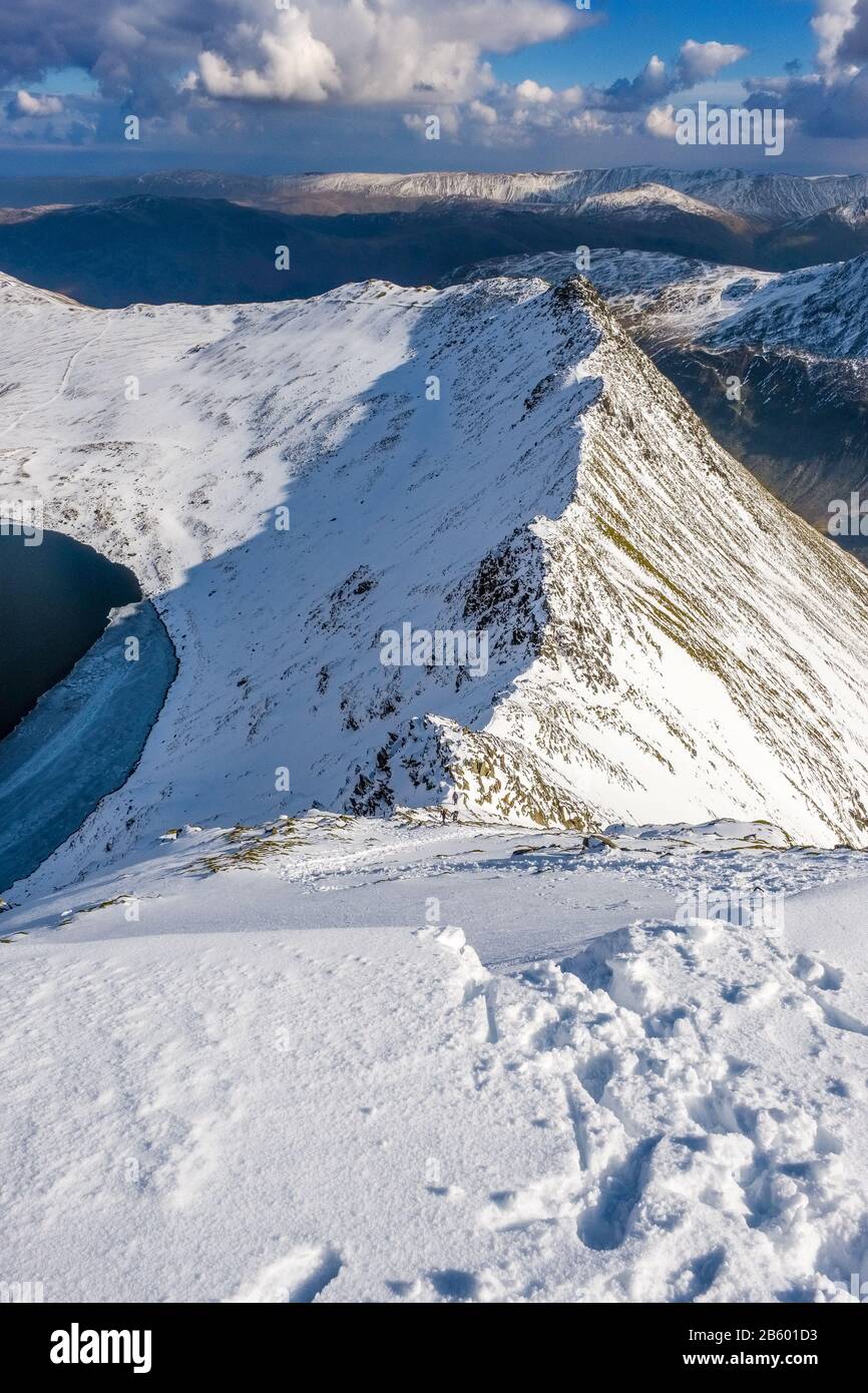 Striding Edge on Helvellyn in winter. The ridge is a popular summer ...