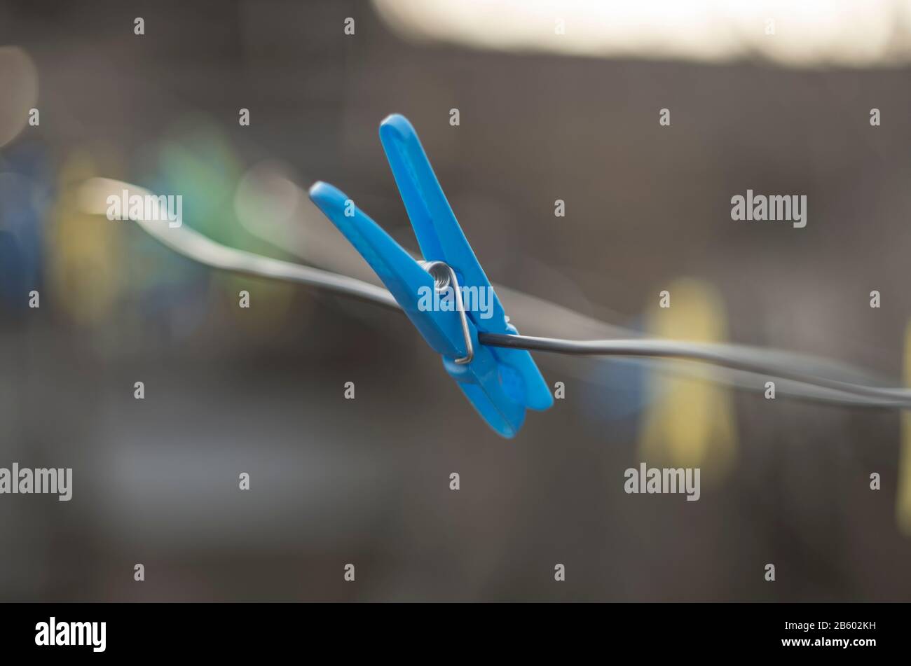 single clothes pin with blured background Stock Photo - Alamy