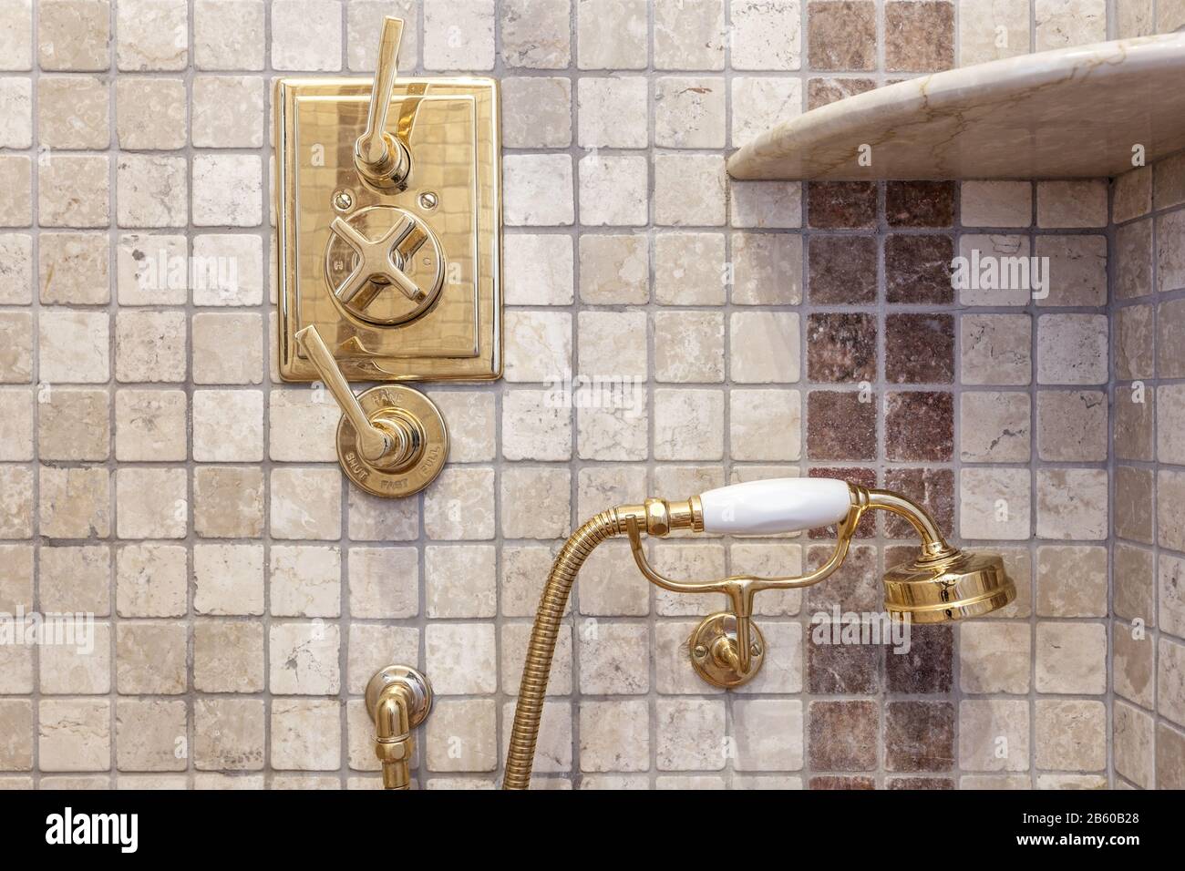Vintage faucet and shower. Gold color in the bath Stock Photo - Alamy