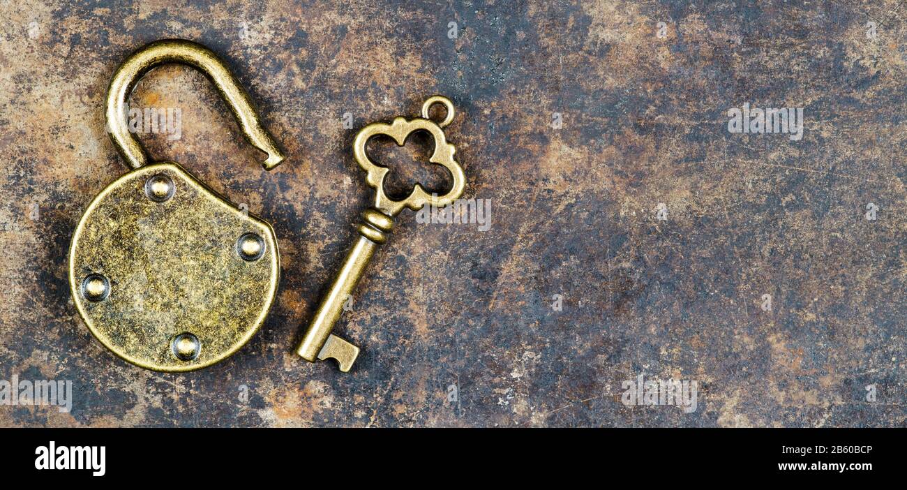 Escape room concept. Web banner of a vintage golden key and unlocked ...