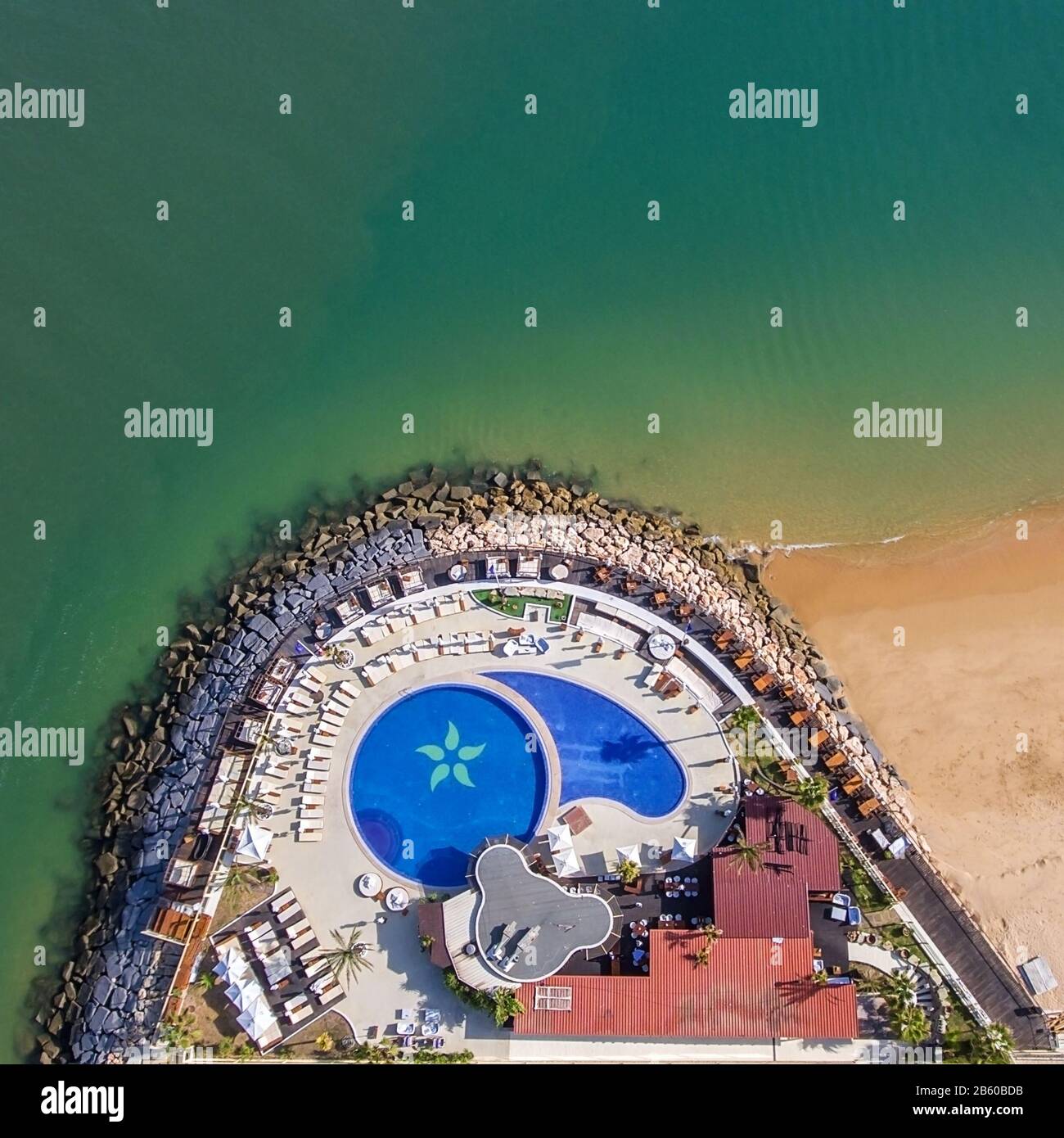 Swimming pool on the ocean. The photo from the sky is shot by drones ...