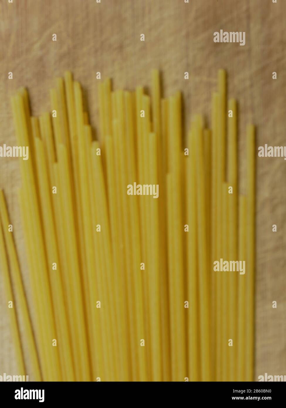 Close-up of Uncooked Spaghetti On A Scratched Wooden Cutting Board, Top ...