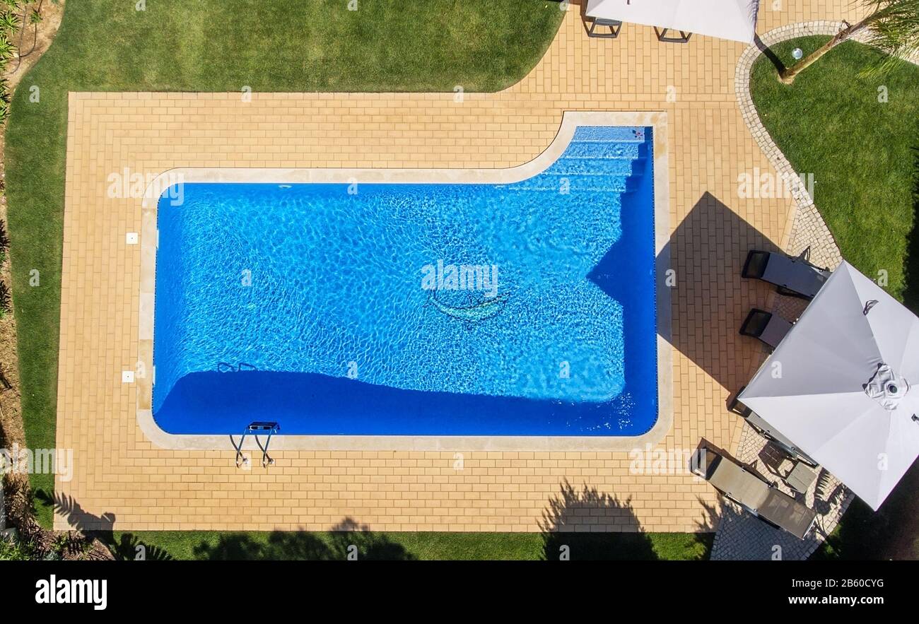 Aerial view of swimming pool outside hotel. Beautiful pool ready to ...