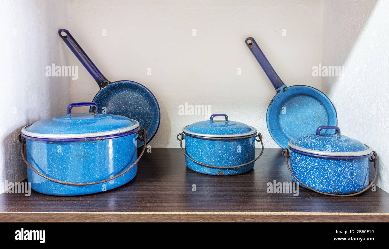 Old cooking pot isolated on white. On the shelf Stock Photo - Alamy