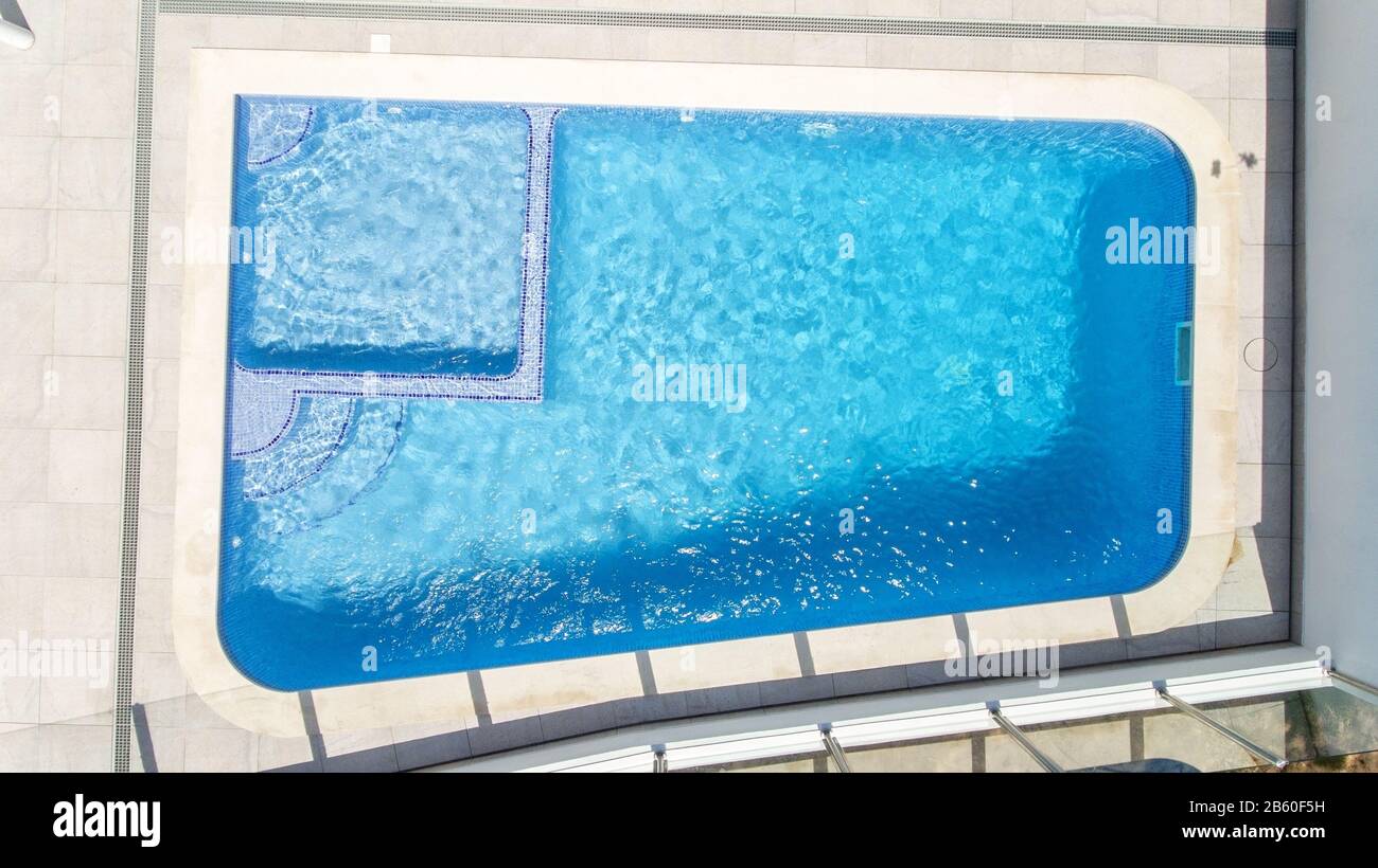 Aerial. Normal pool with water from the sky. Shooted by the drone ...