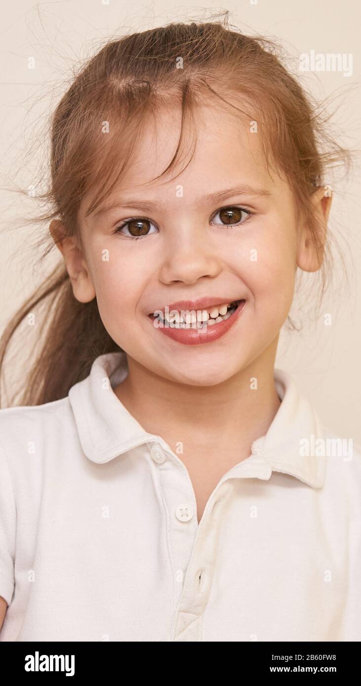 Young beauty girl portrait. Look at camera. Neutral background Stock ...
