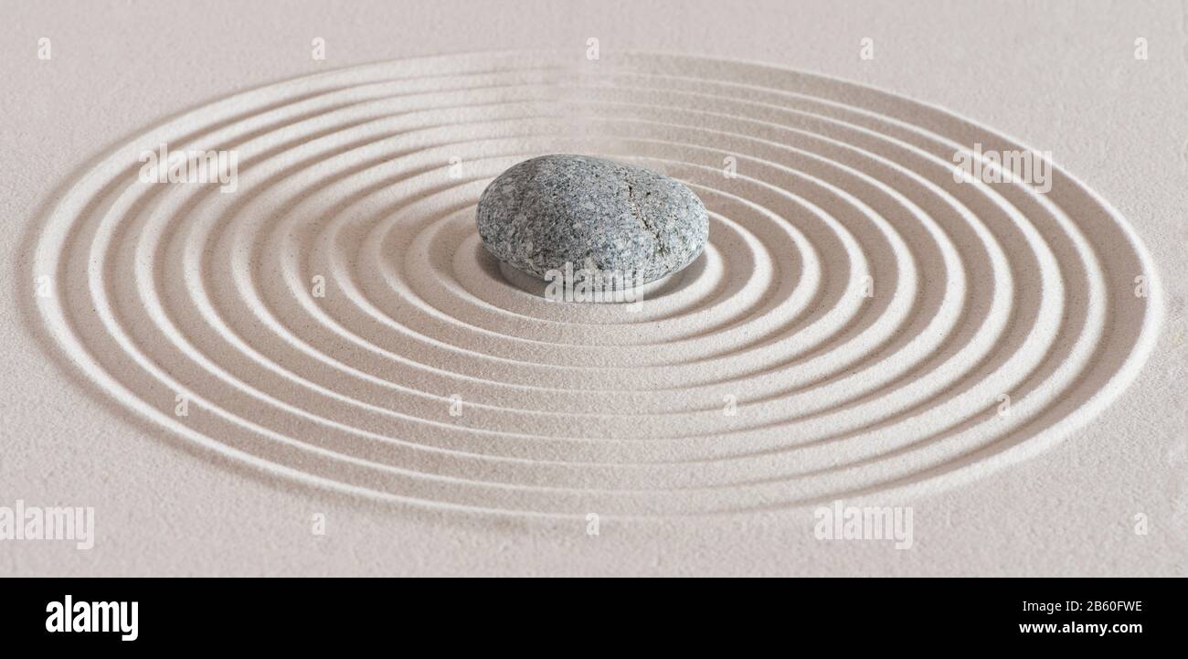 Japanese zen garden with stone in textured white sand Stock Photo - Alamy