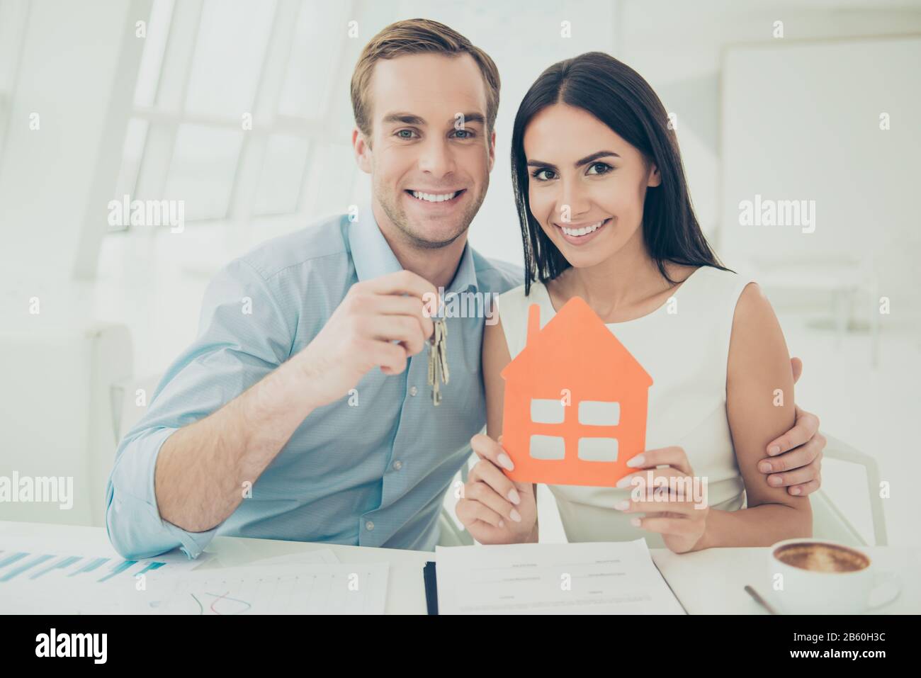 Portrait of happy young family buying new house Stock Photo - Alamy