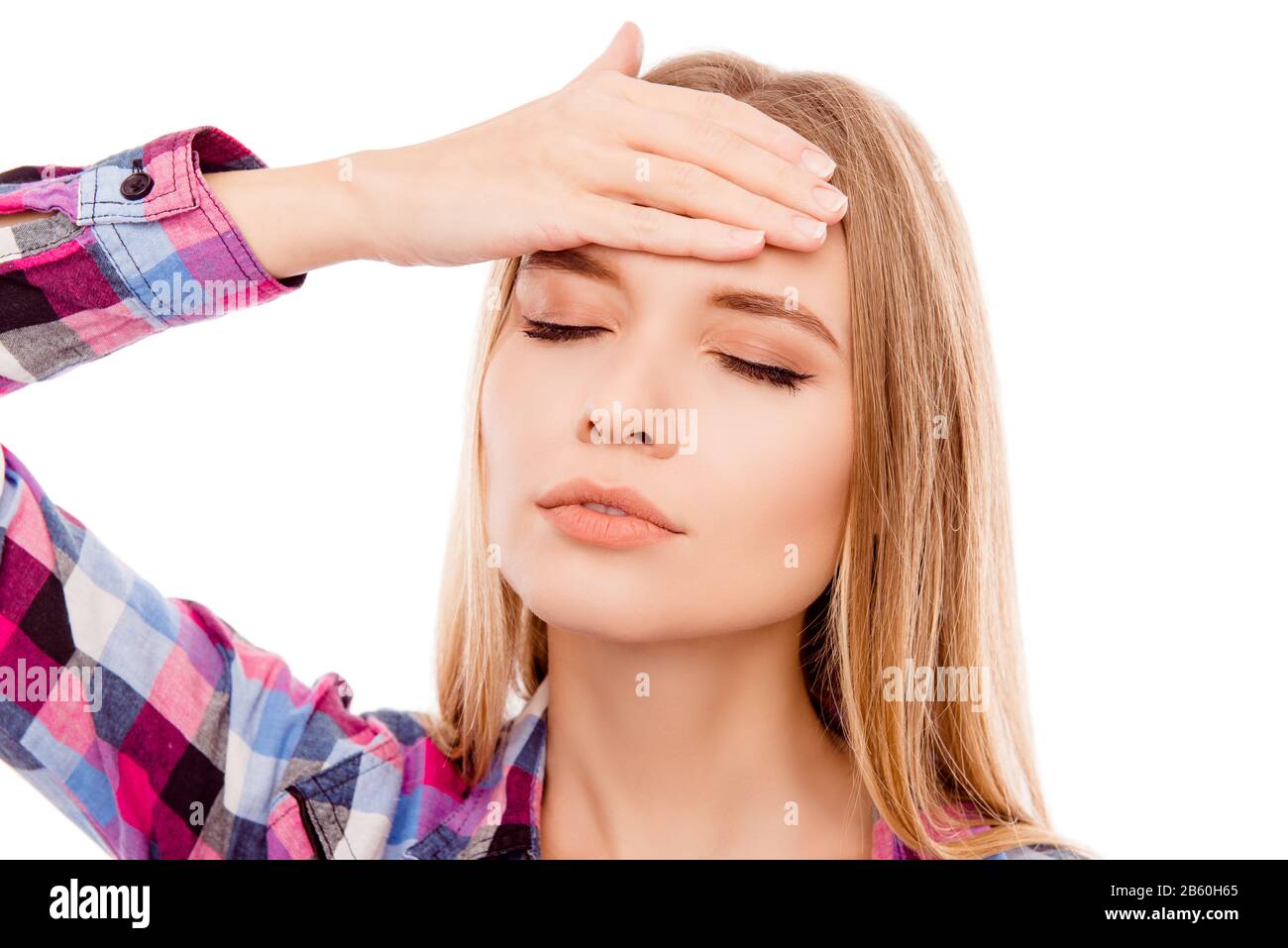 Portrait of pretty blonde woman with headache touching head Stock Photo ...