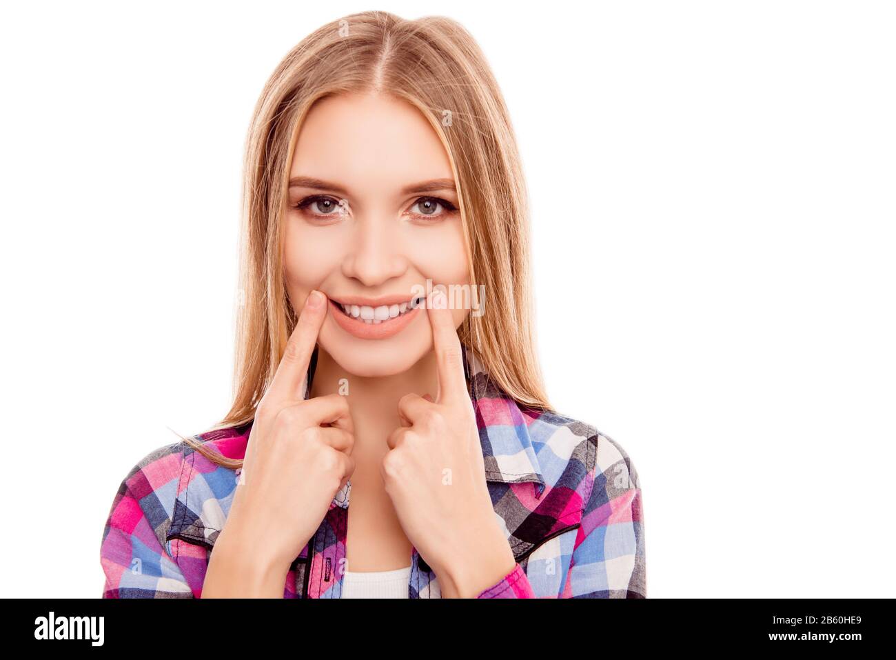 Pretty woman stretching the corners of her mouth and making smile Stock ...