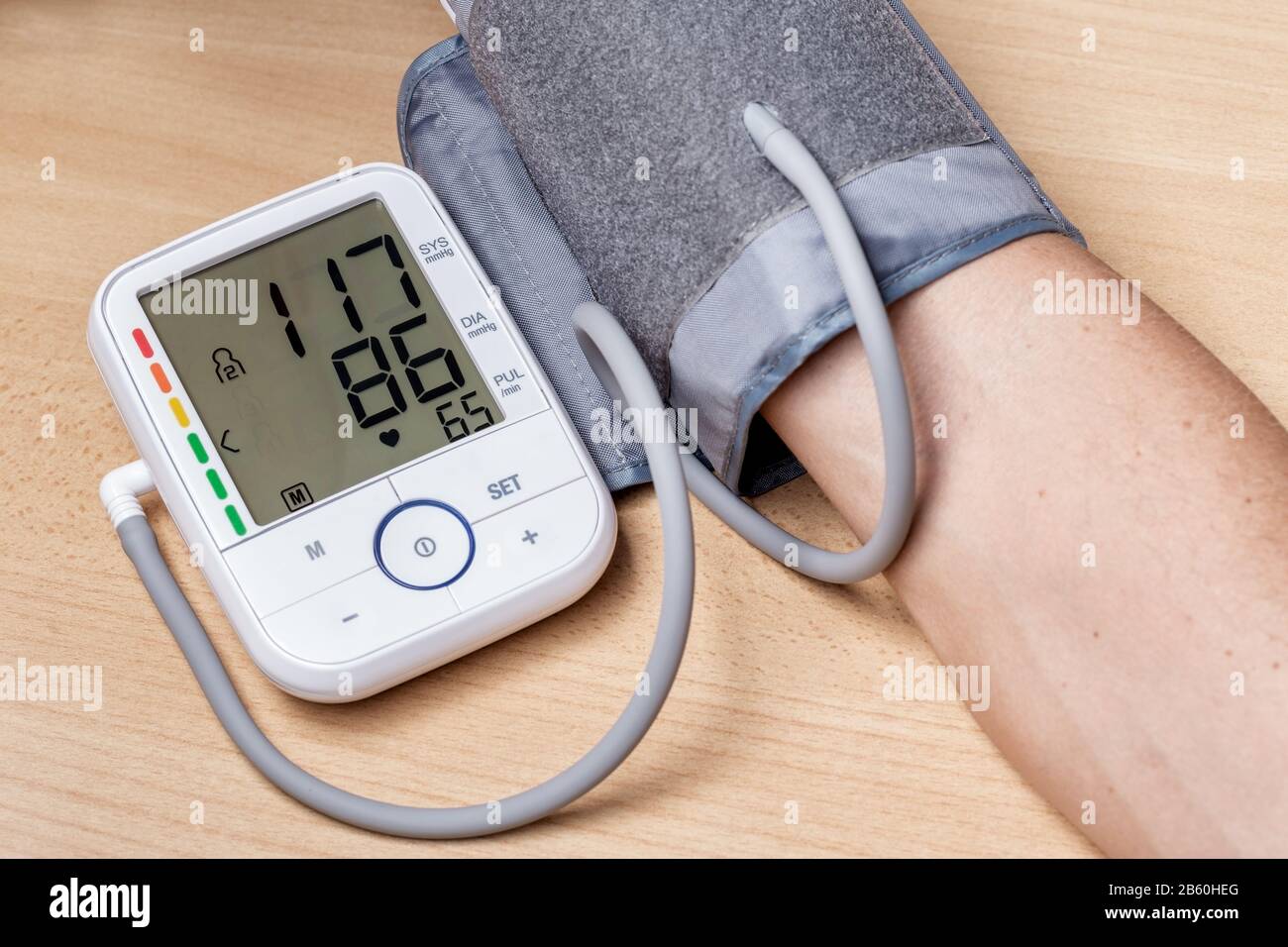 Measurement of blood pressure in a man hand Stock Photo - Alamy