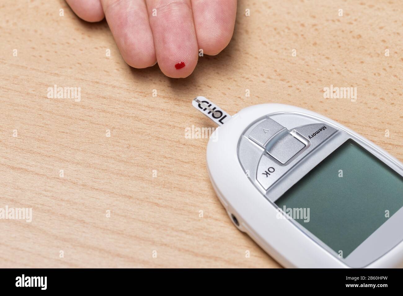 Device for measuring cholesterol, and insulin. Blood test. Close up ...
