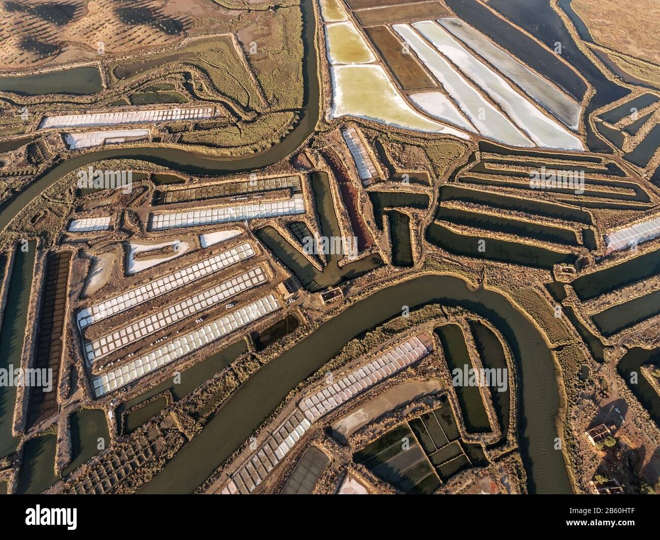 Aerial. Textured fields of swampy salt lakes. Salines of Portugal. Vila ...