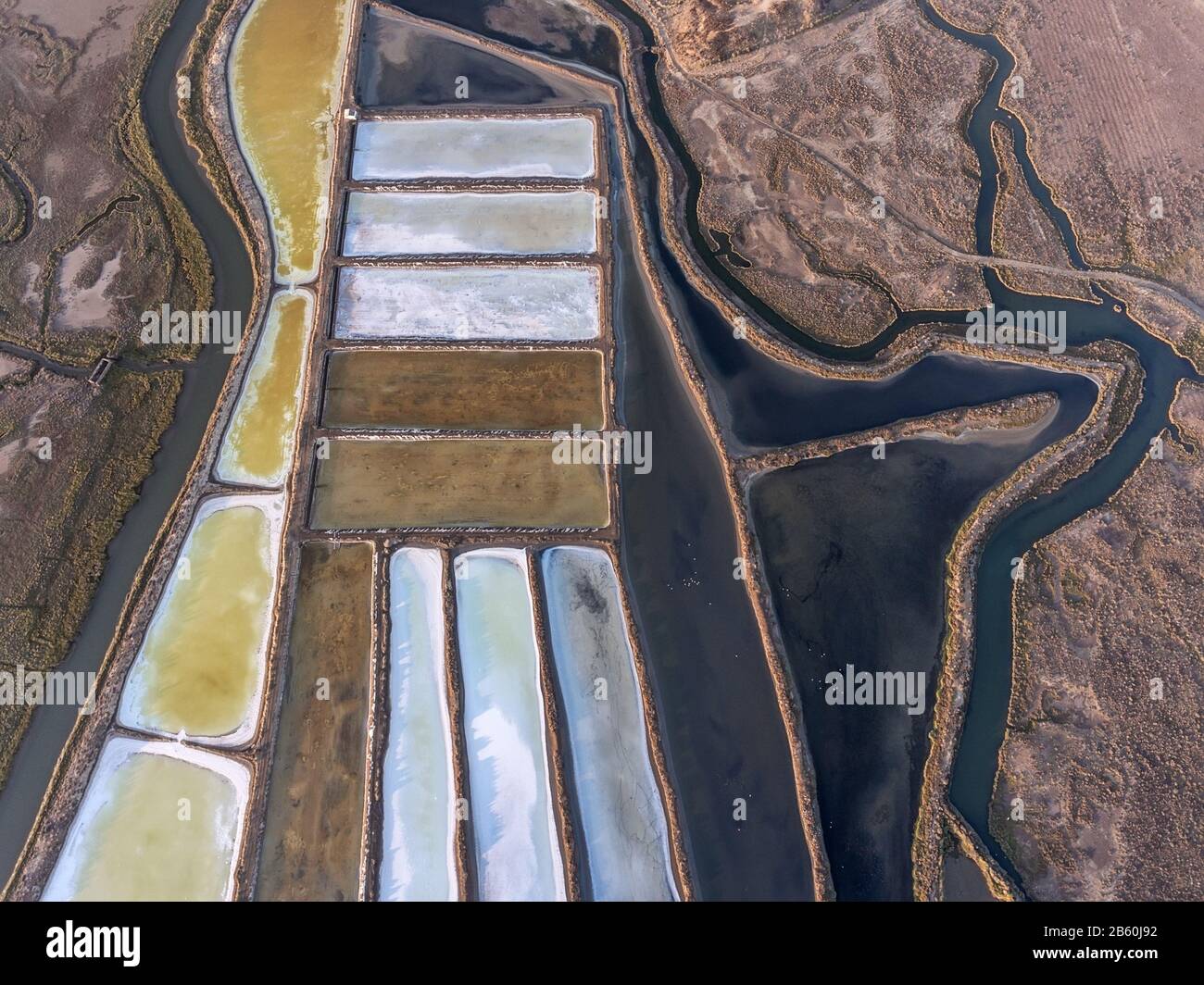 Aerial. Textured fields of swampy salt lakes. Salines of Portugal. Vila ...
