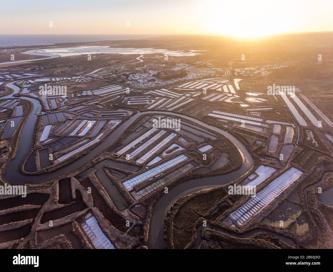 Aerial. Textured fields of swampy salt lakes. Salines of Portugal. Vila ...