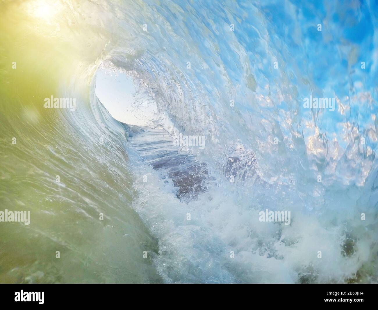 Falling waves during surfing and sunset. Faro Portugal Algarve Stock ...