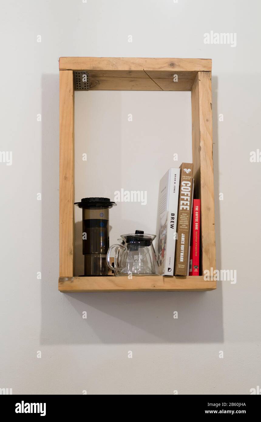 Rectangular Shelf With Coffee Books and Coffee Maker on White Wall ...