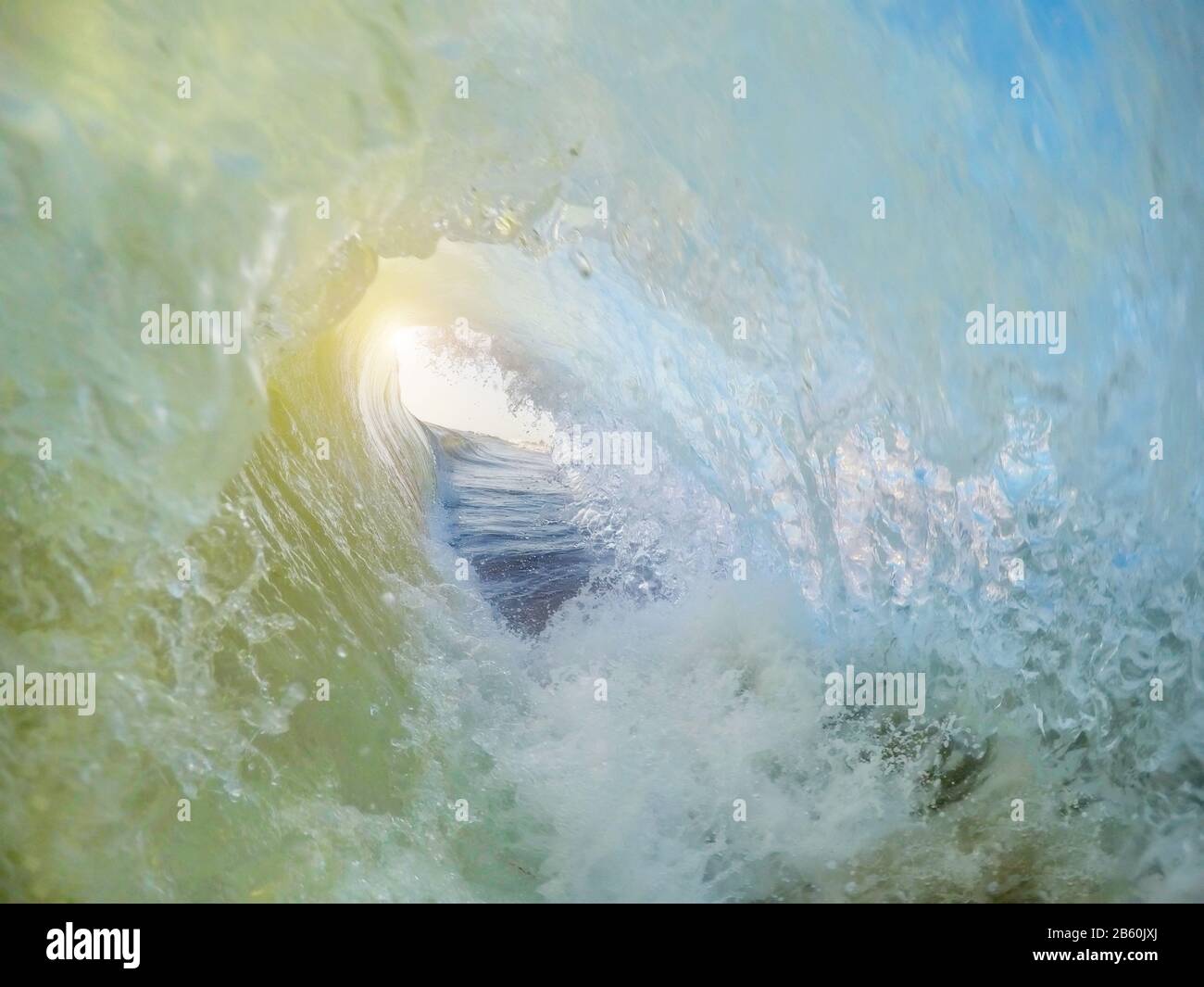 Falling waves during surfing and sunset. Faro Portugal Algarve Stock ...