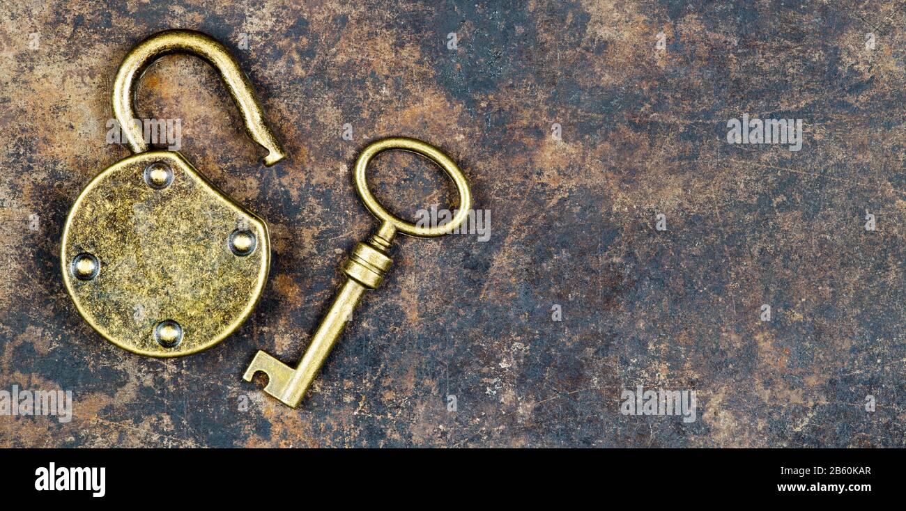 Solution, success concept, gold key and unlocked padlock on metal ...