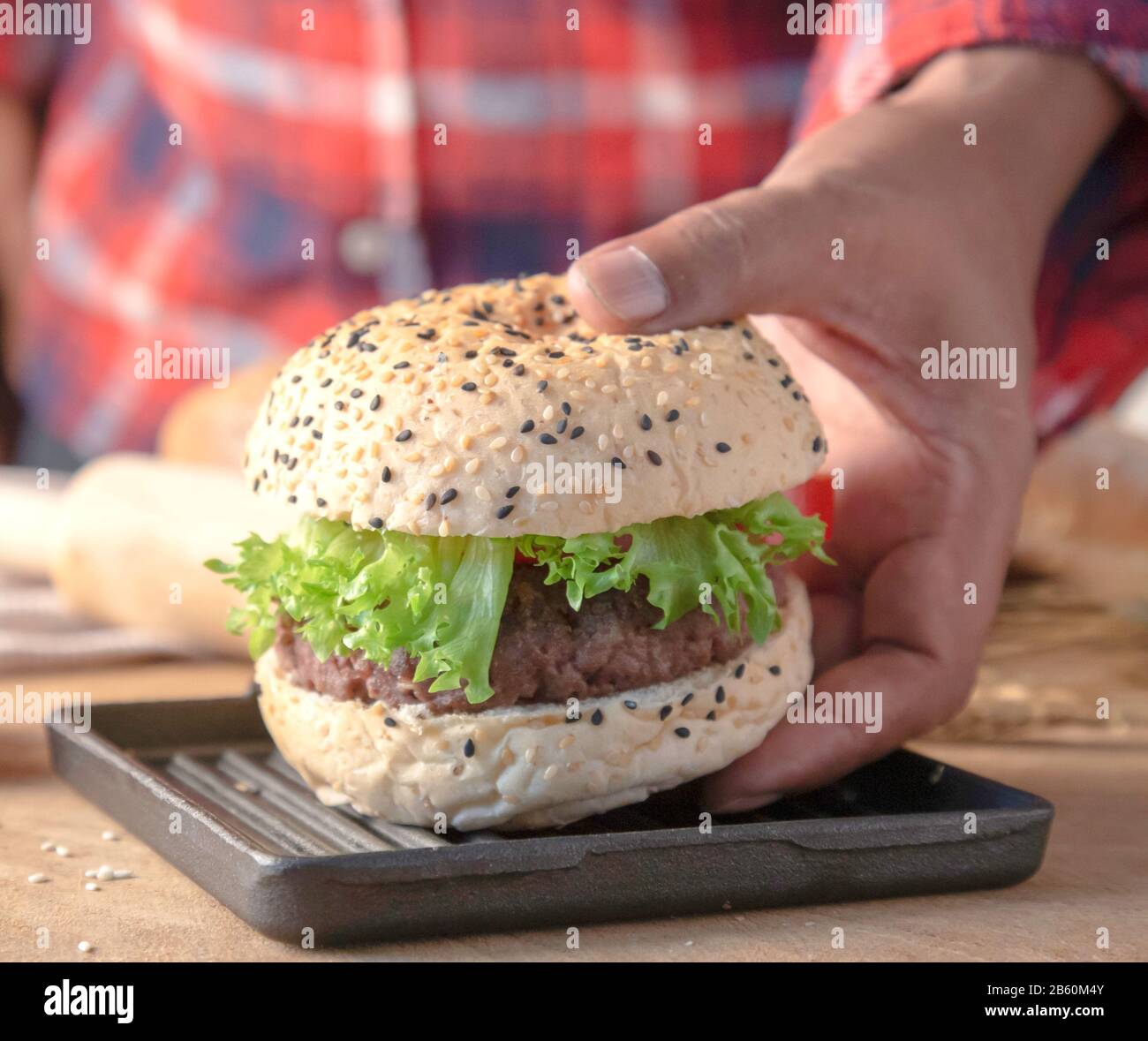 The butler chef making hamburger homemade in kitchen Stock Photo - Alamy