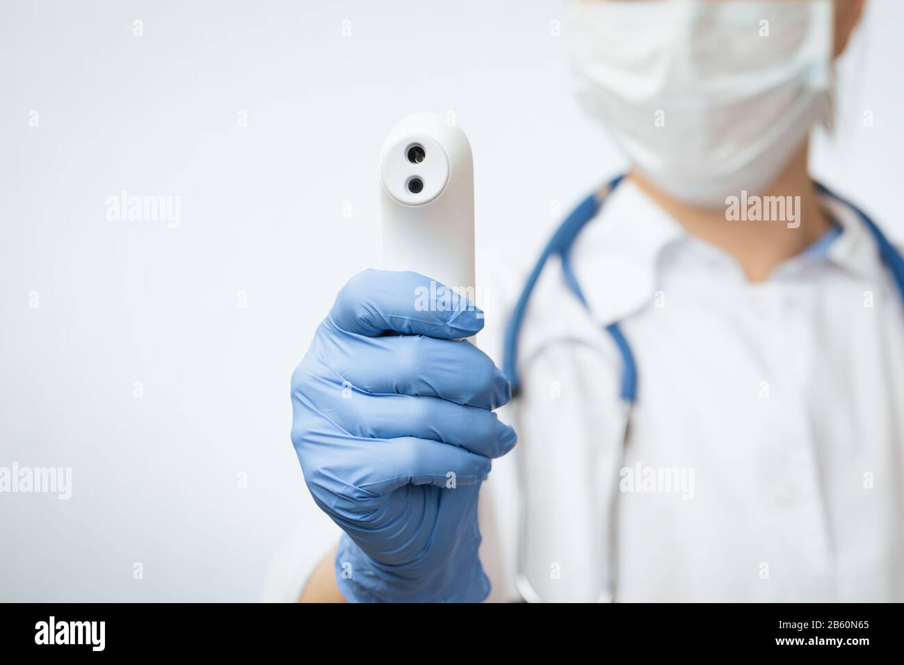 Close-up shot of doctor wearing protective surgical mask ready to use ...