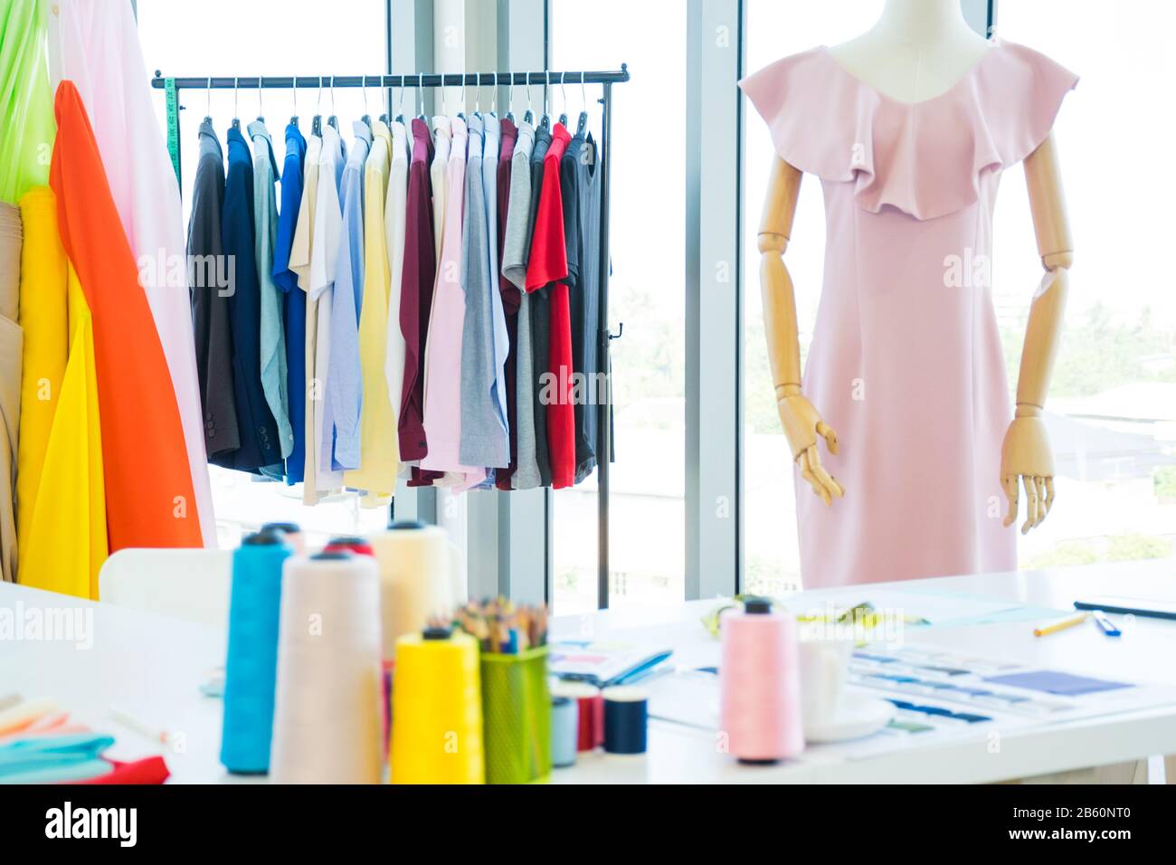 Fashion designer working desk with colorful sewing thread, colored ...