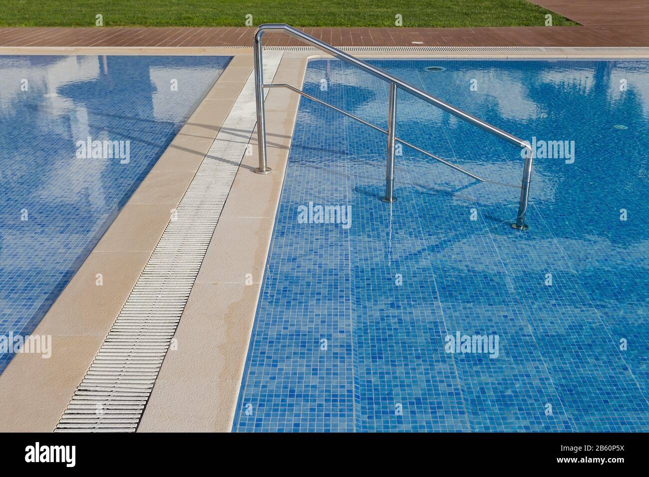 Handrails to enter the pool. For tourists Stock Photo - Alamy