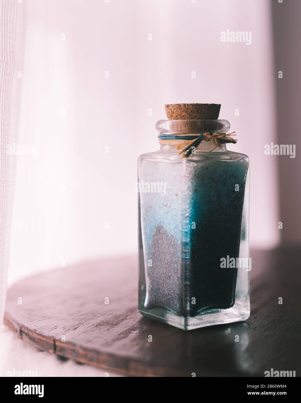fancy bottle with blue bath salts for relaxing spa treatments with ...