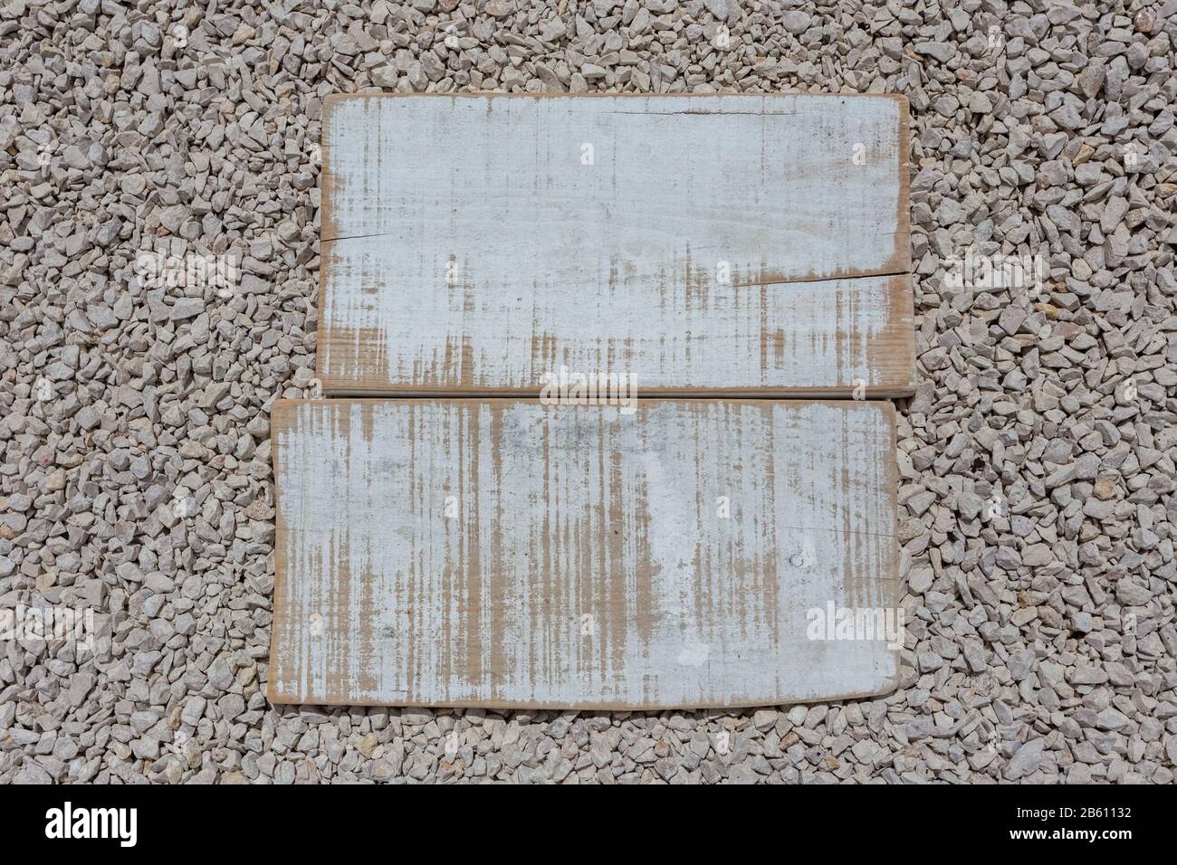 Frame for labels. Boards on the rubble Stock Photo - Alamy